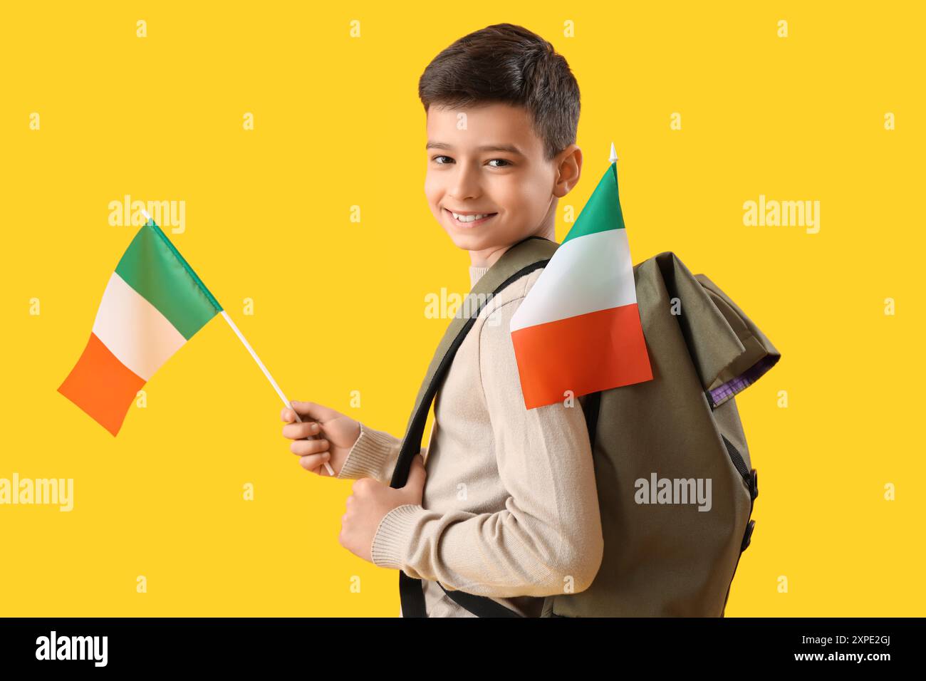 Little boy with backpack and flags of Italy on yellow background Stock ...