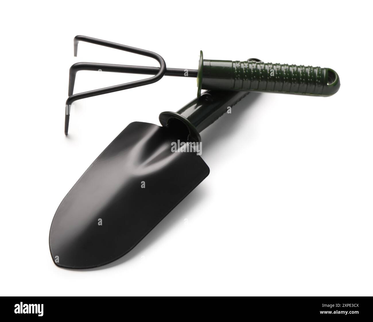 Shovel and rake on white background. Gardening tools Stock Photo - Alamy