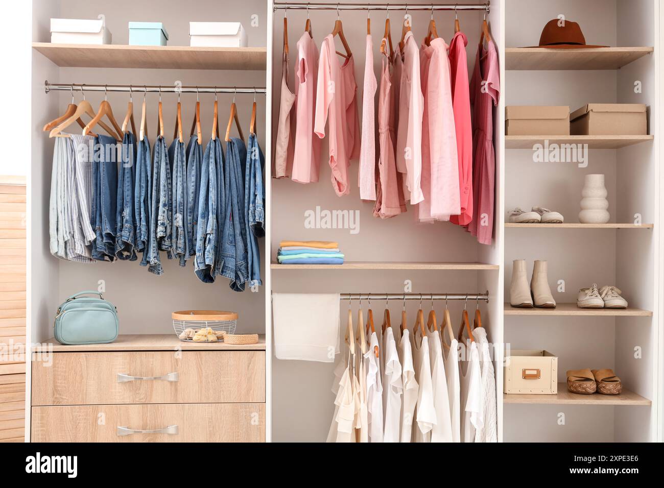 Wardrobe with different clothes and accessories in dressing room Stock ...