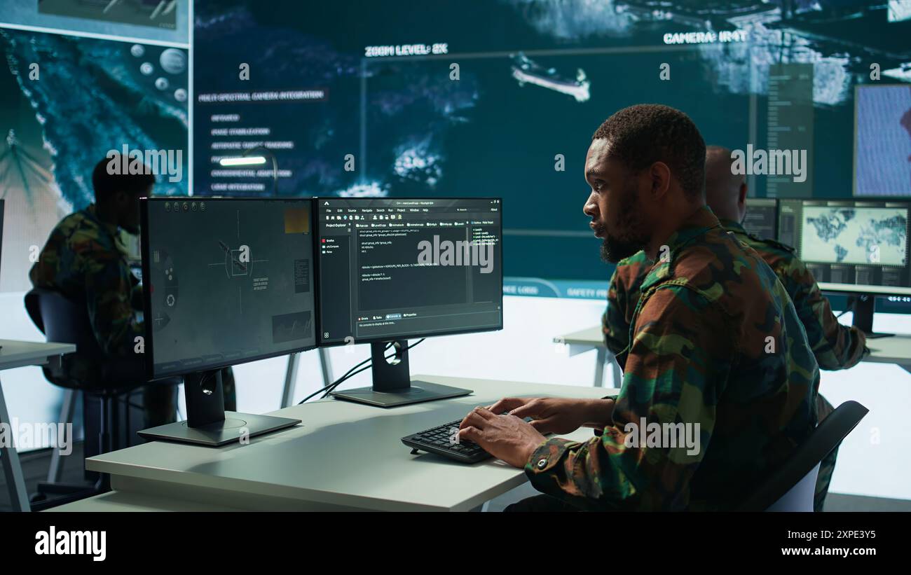 Soldier working with AI intelligence on pc in control room, processing ...