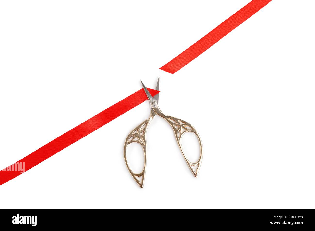 Cut red ribbon with scissors on white background Stock Photo - Alamy