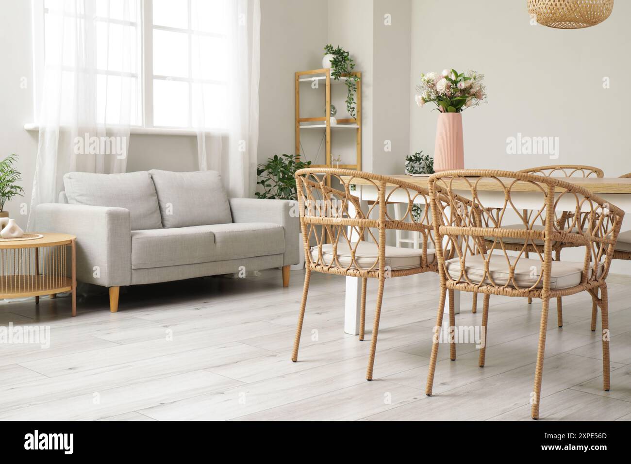 Table, chair and sofa in dining room Stock Photo - Alamy