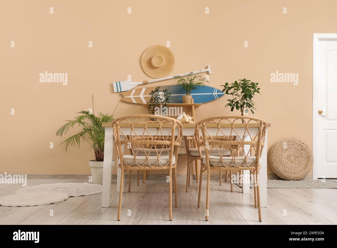 Dining table and surfboard with paddle Stock Photo - Alamy
