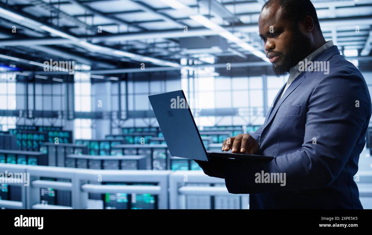 Software Developer In Server Hub Checking Recovery Plan On Laptop