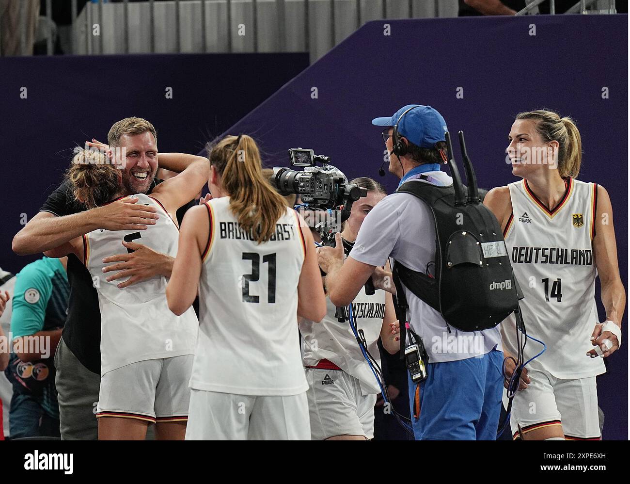 Paris, France. 5th Aug, 2024. Players of Germany celebrate with German former NBA star Dirk ...