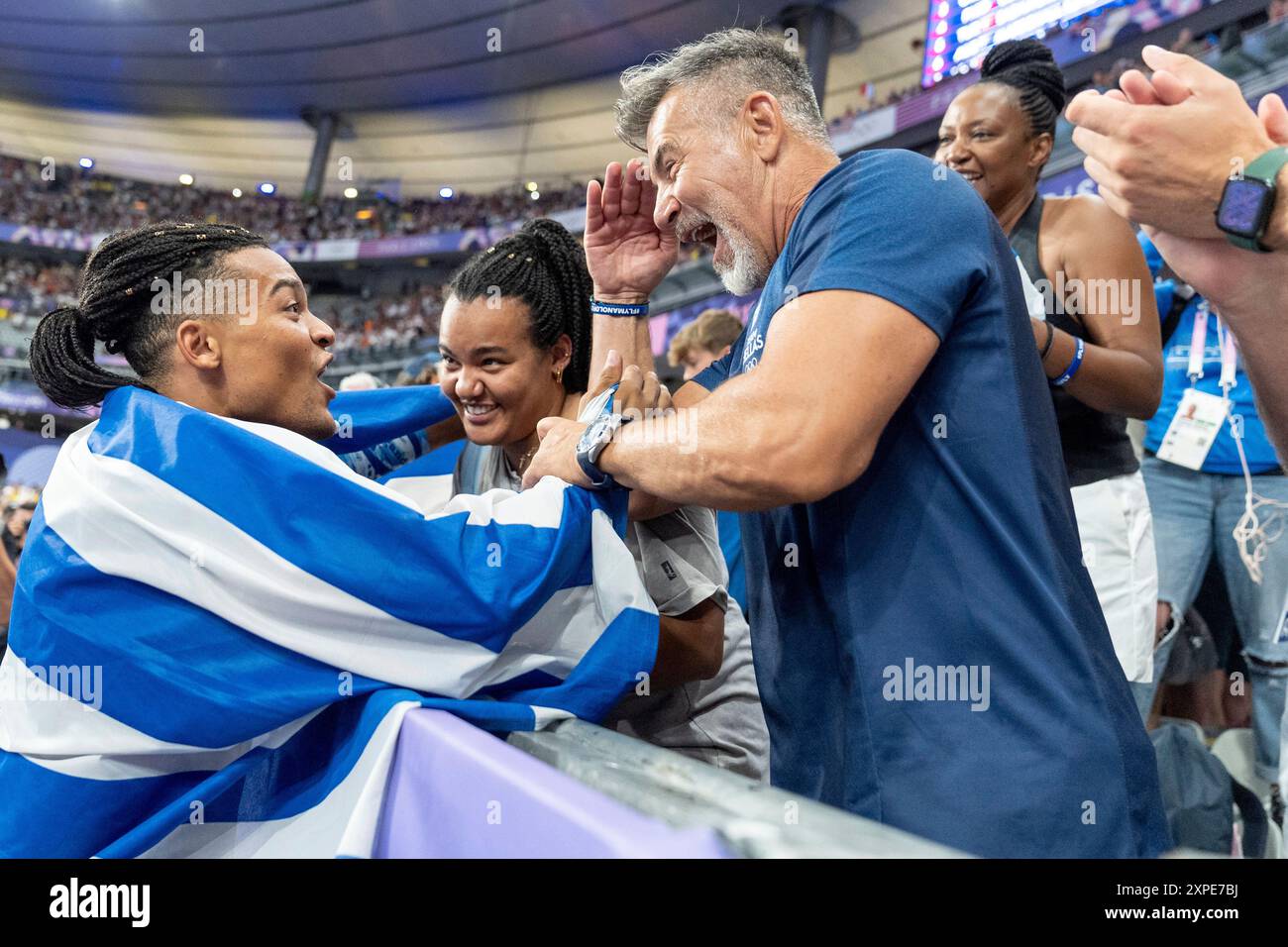 Emmanouil Karalis, of Greece, from left, celebrates with his sister ...