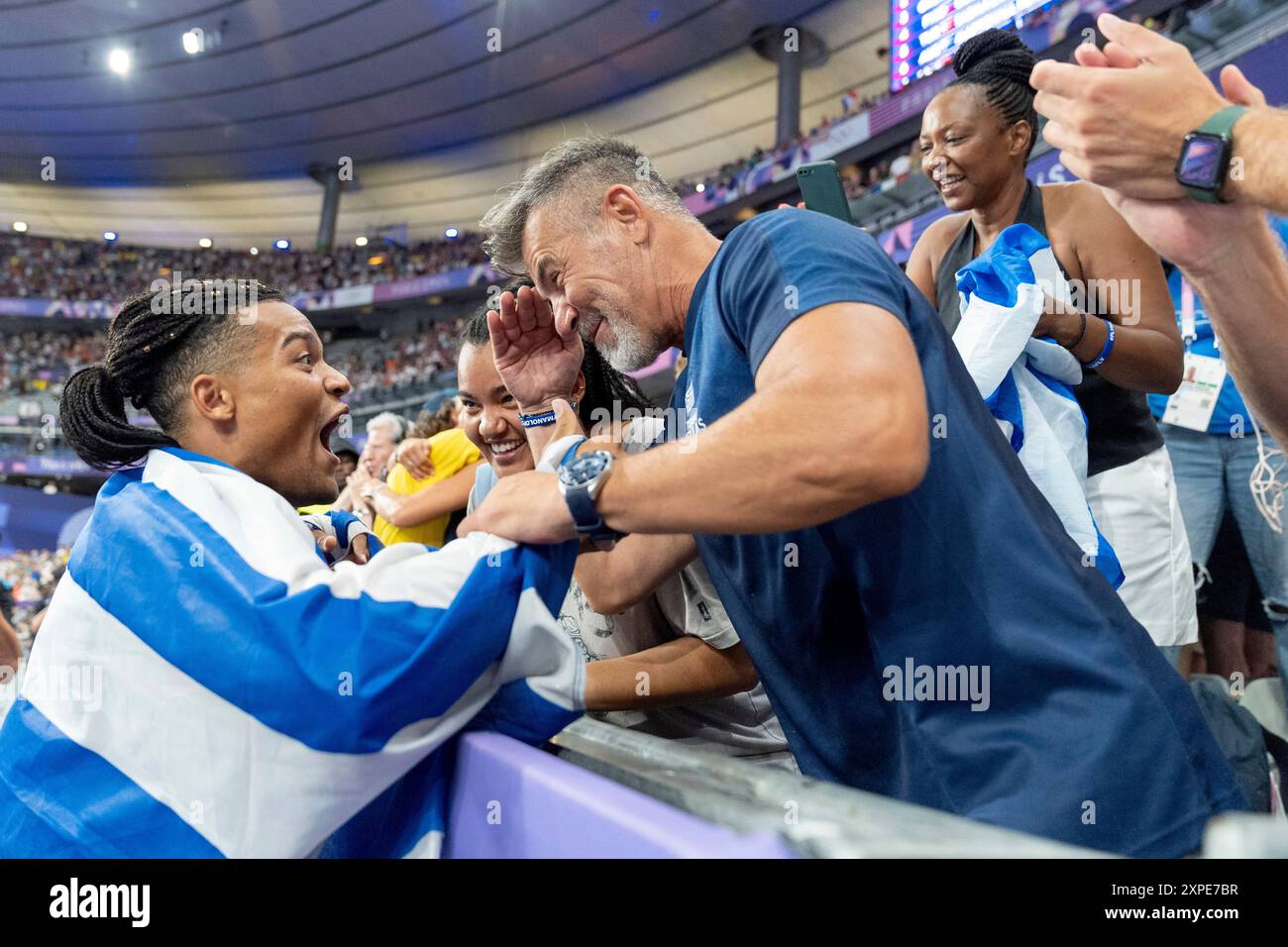 Emmanouil Karalis, of Greece, from left, celebrates with his sister ...
