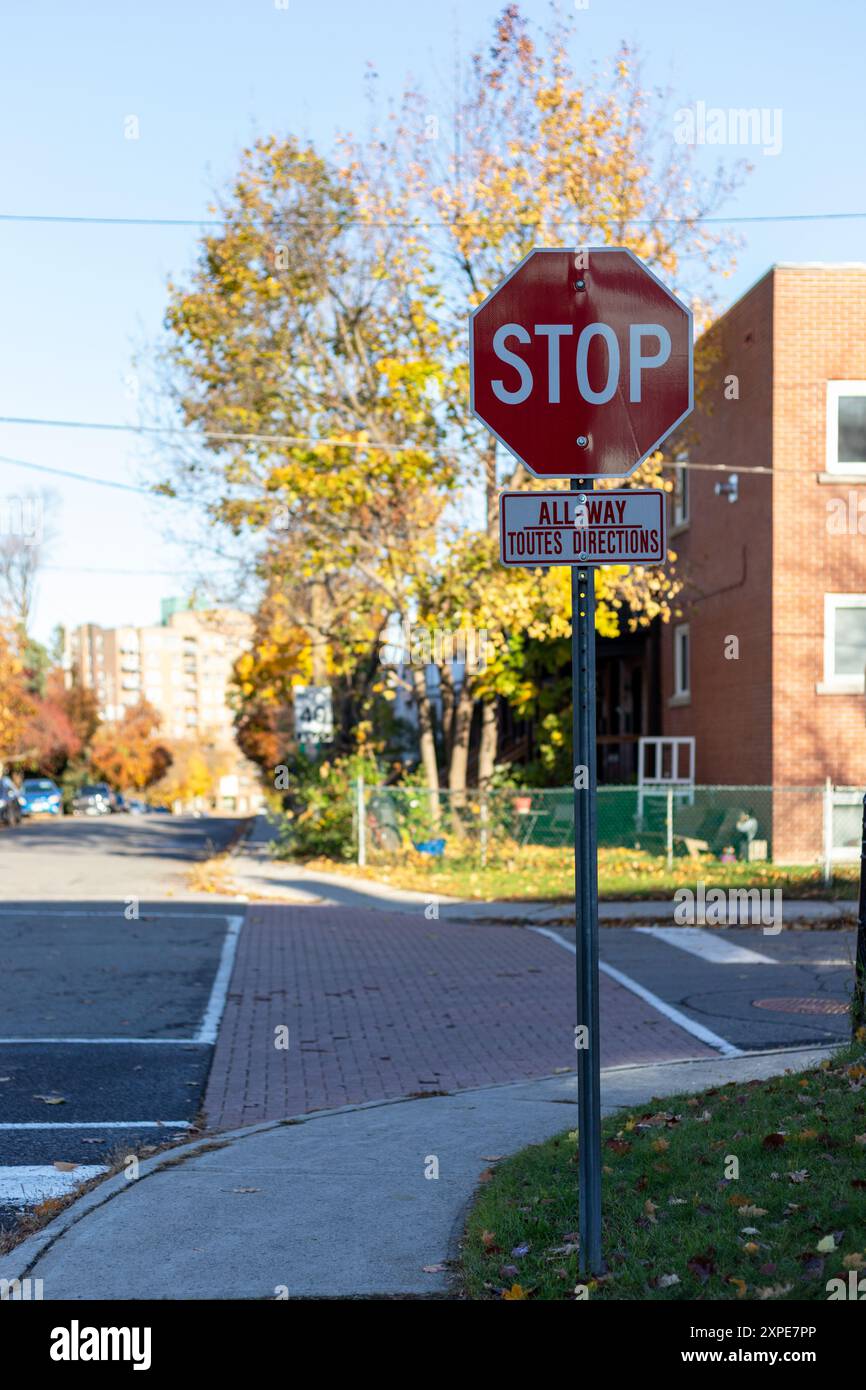 Red stop sign on a road at an intersection in Ottawa, Canada Stock ...