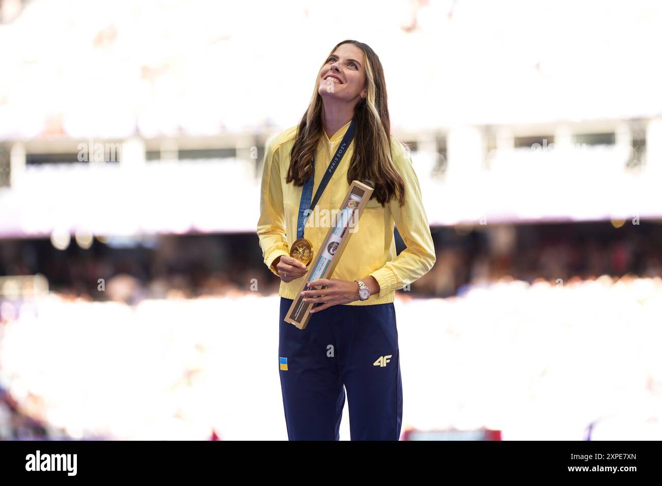 Gold medallist Yaroslava Mahuchikh of Ukraine celebrates on the podium ...