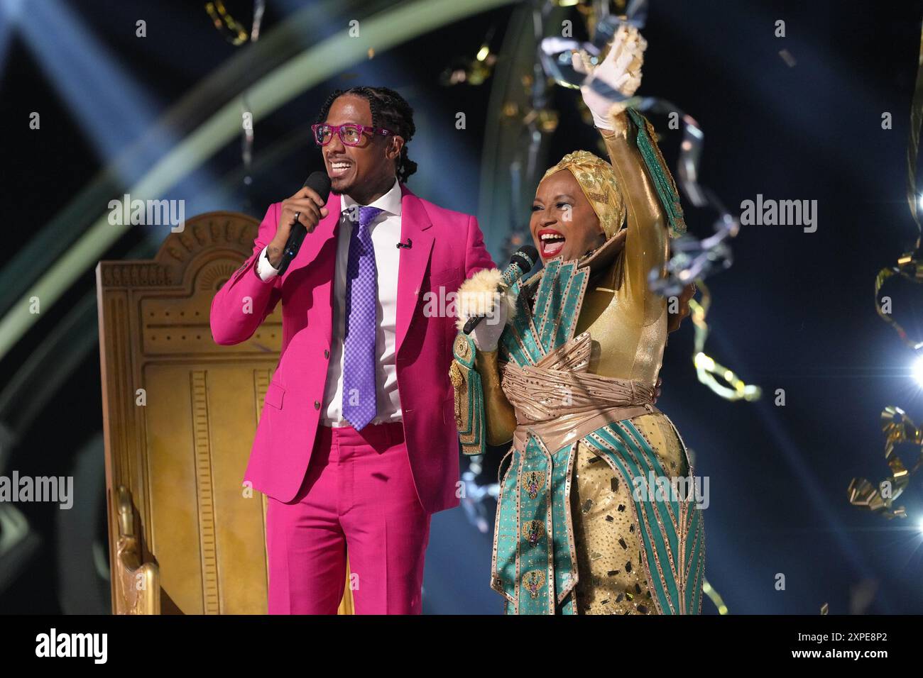 THE MASKED SINGER, from left: Nick Cannon, Cleocatra (voice: Jenifer ...