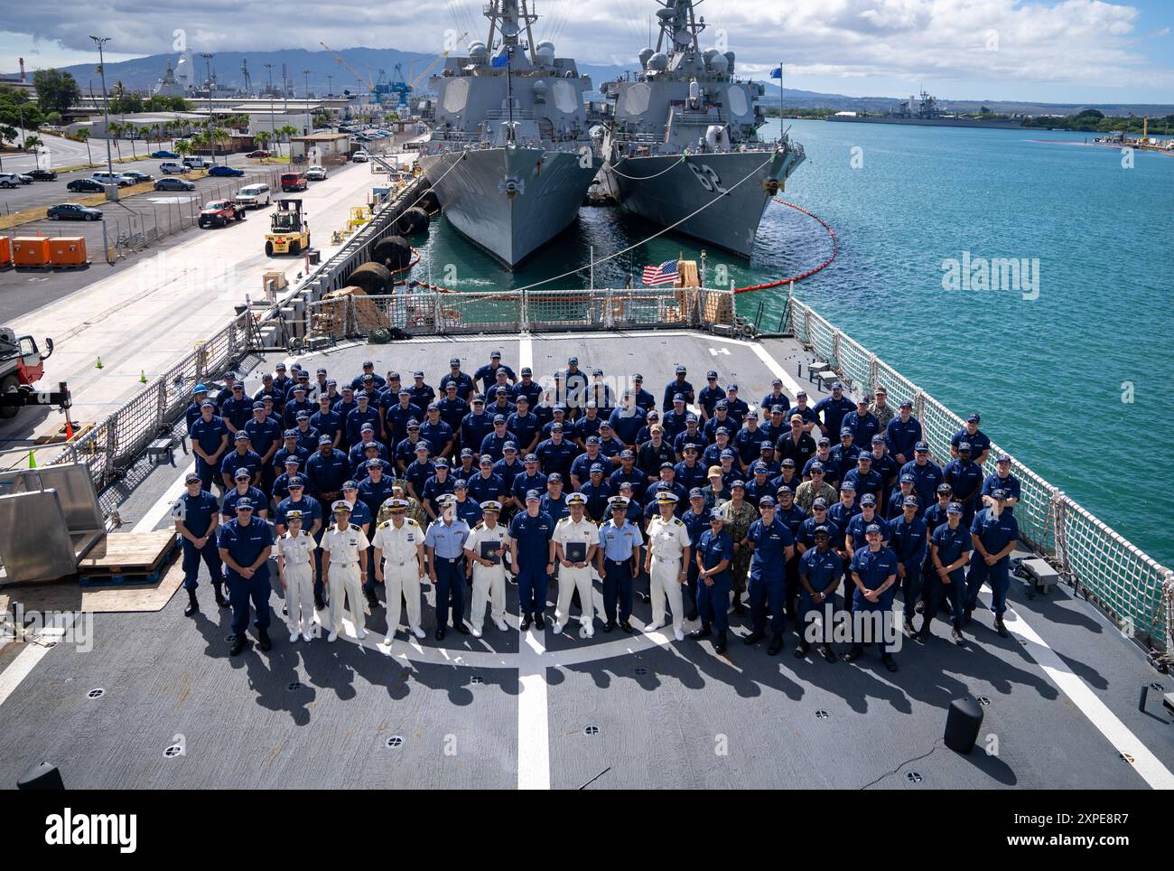The crew of U.S. Coast Guard Cutter Waesche (WMSL 751), a Japan Coast ...