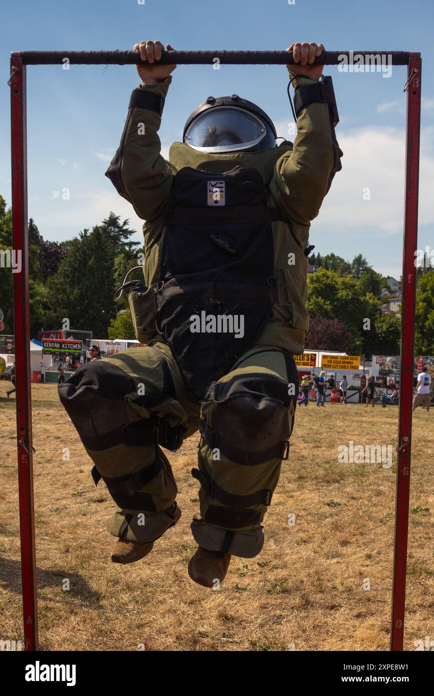 A U.S. service member participates in a Marine Corps pull-up challenge ...