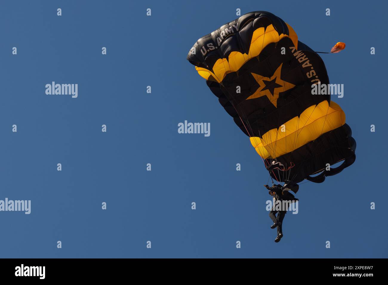 A member of the U.S. Army Golden Knights Parachute Team participates in ...