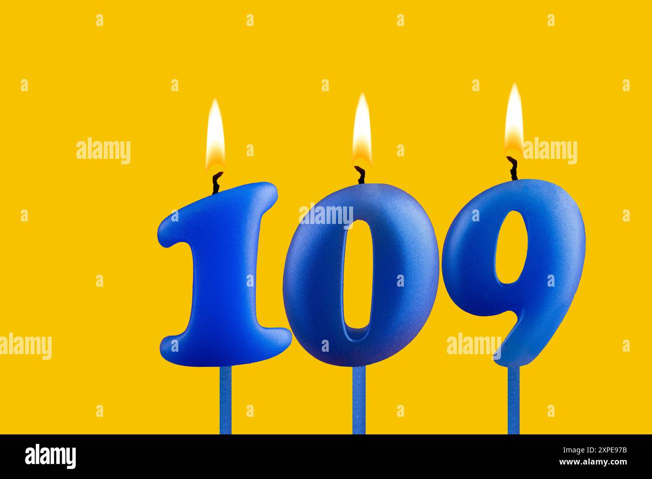 Blue birthday candle on yellow background - Number 109 Stock Photo - Alamy