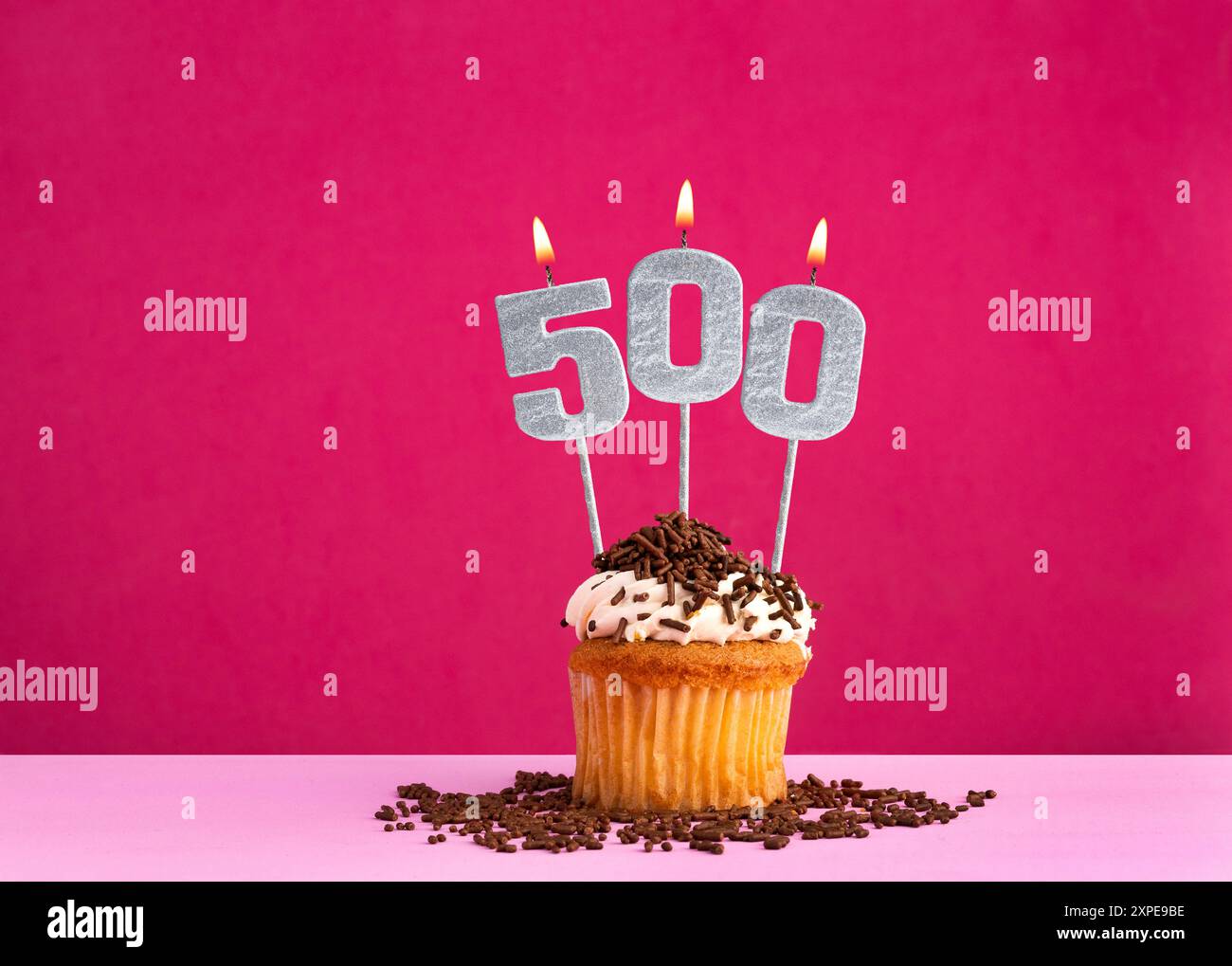 Birthday cupcake with candle number 500 - Birthday card on pink ...