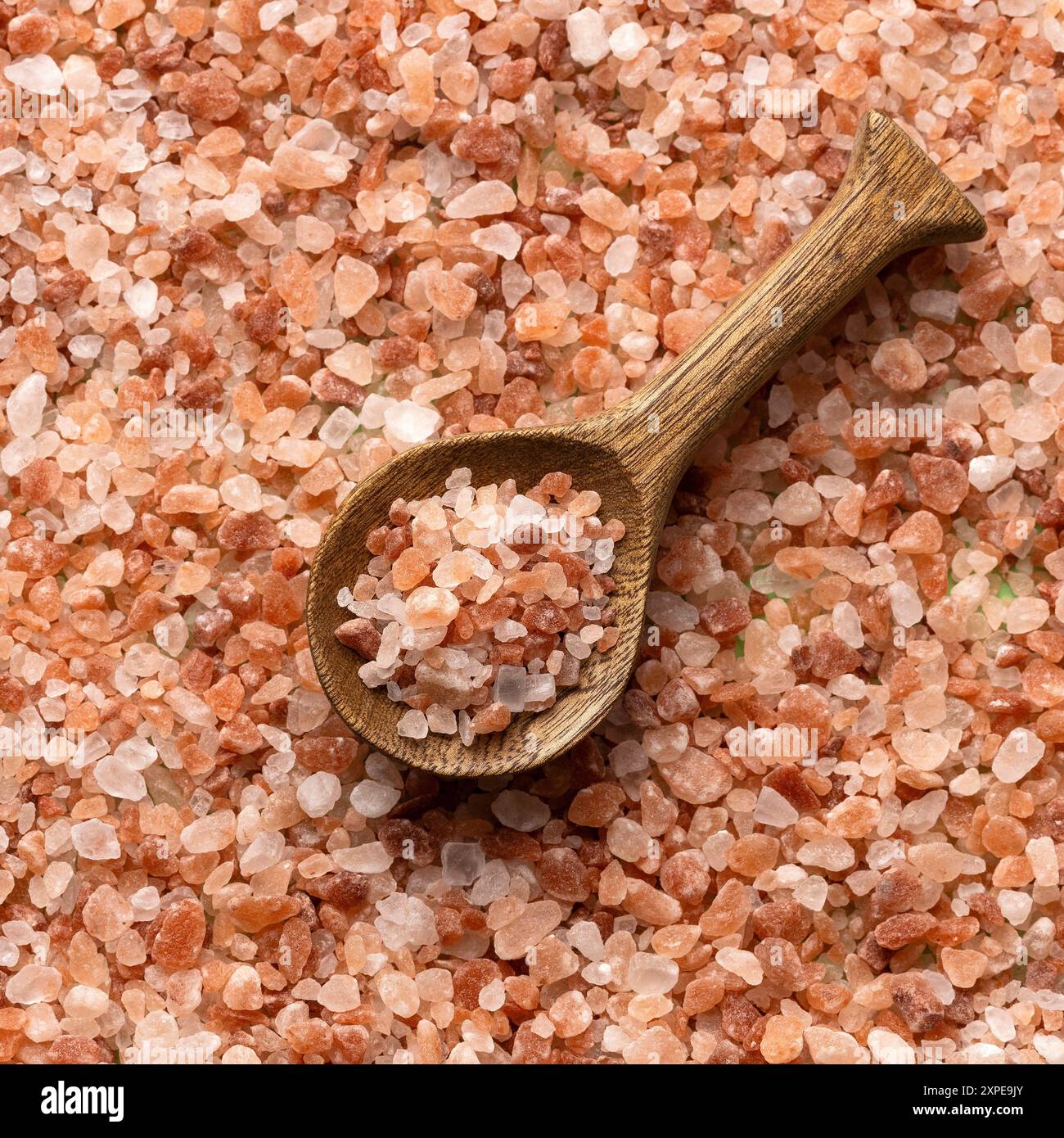 Himalayan pink salt crystals on spoon - Exotic cooking ingredient Stock ...