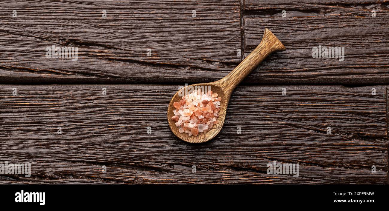 Himalayan pink salt crystals on spoon - Exotic cooking ingredient Stock ...