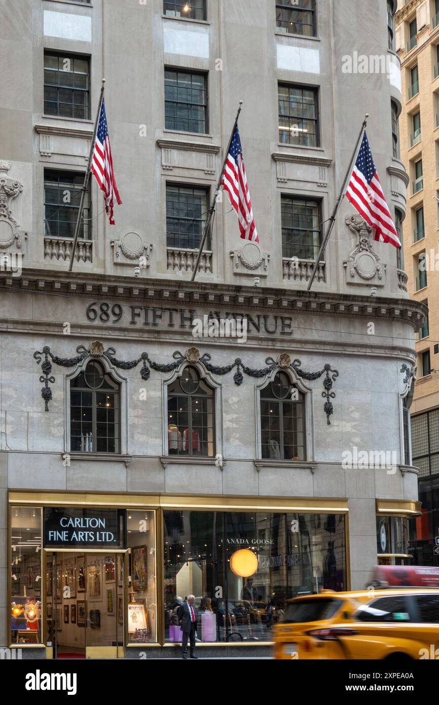 Pedestrians pass in front of many high-end luxury stores on fifth ...