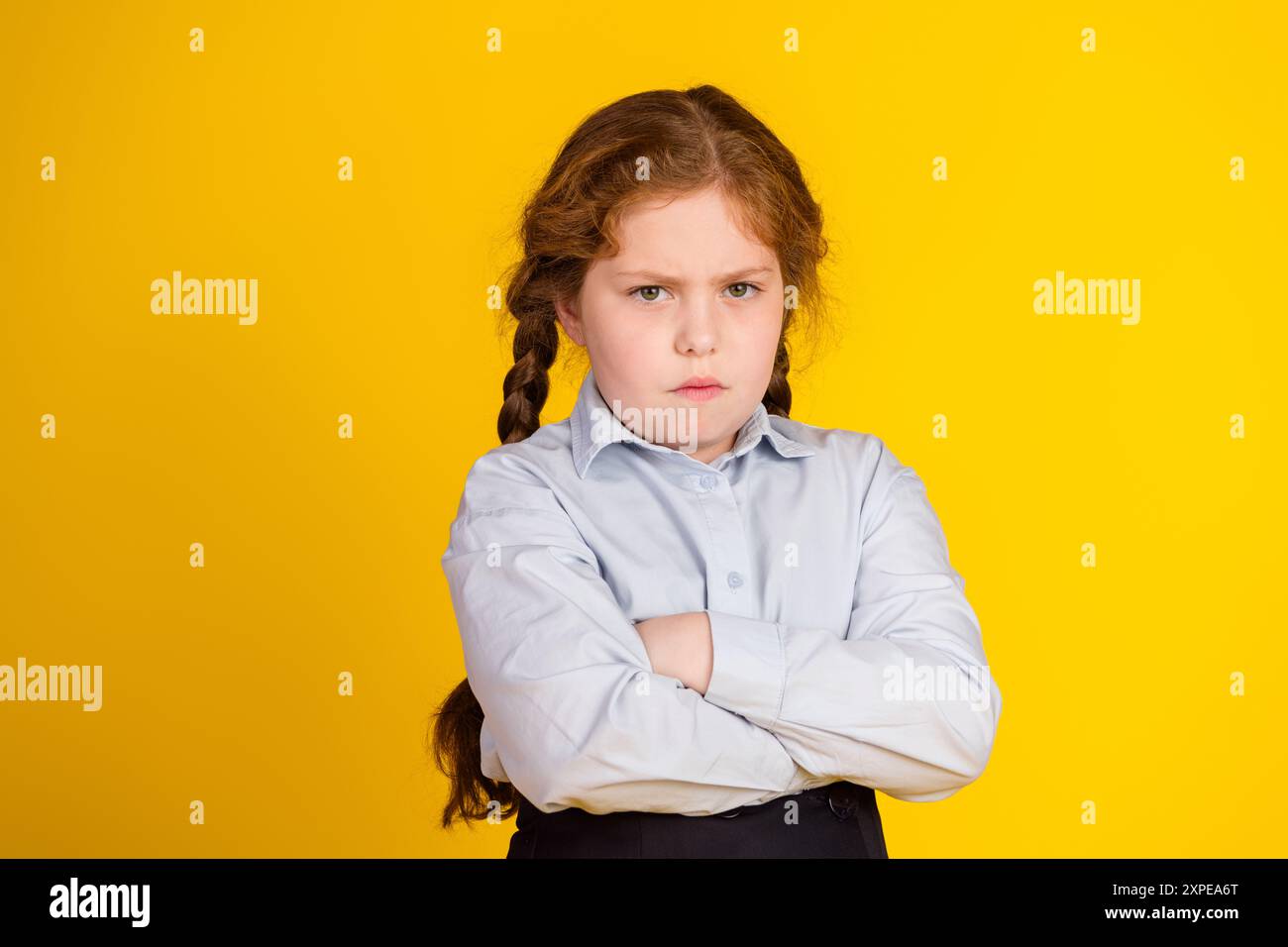 Photo of small schoolkid girl crossed arms sullen face wear uniform ...
