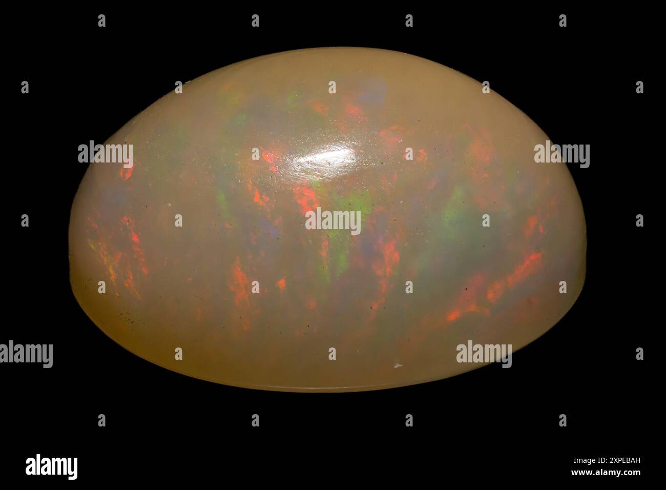 natural rainbow opal gem isolated on the black background Stock Photo ...