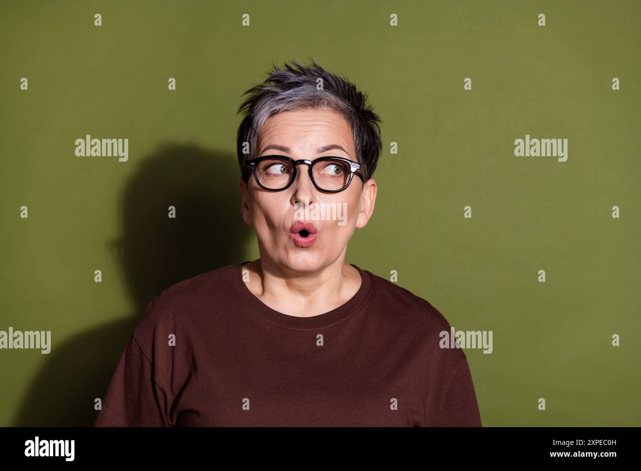 Photo portrait of gray hair beautiful impressed grandmother in brown t ...