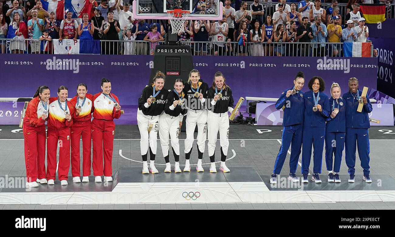 Paris, France. 5th Aug, 2024. Gold medalists team Germany (C), silver medalists team Spain (L ...