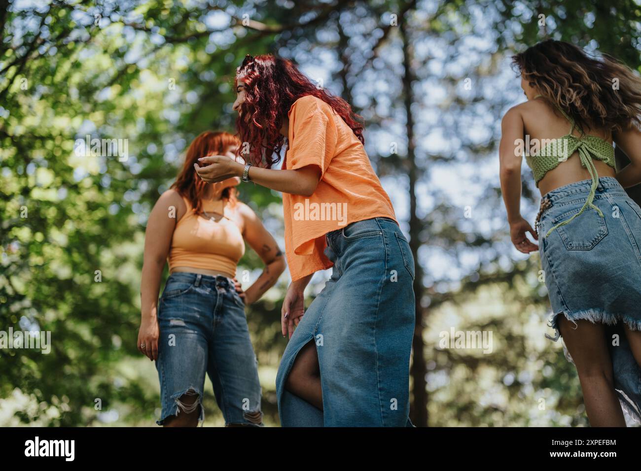 Young teenagers having fun in the park showcasing friendship, joy and ...