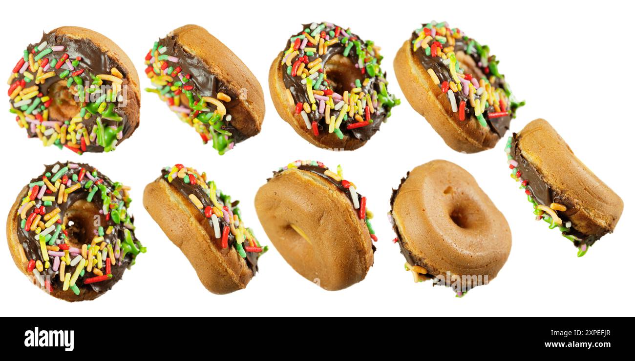 A close up of a donut with sprinkles and chocolate. The donut is cut in ...