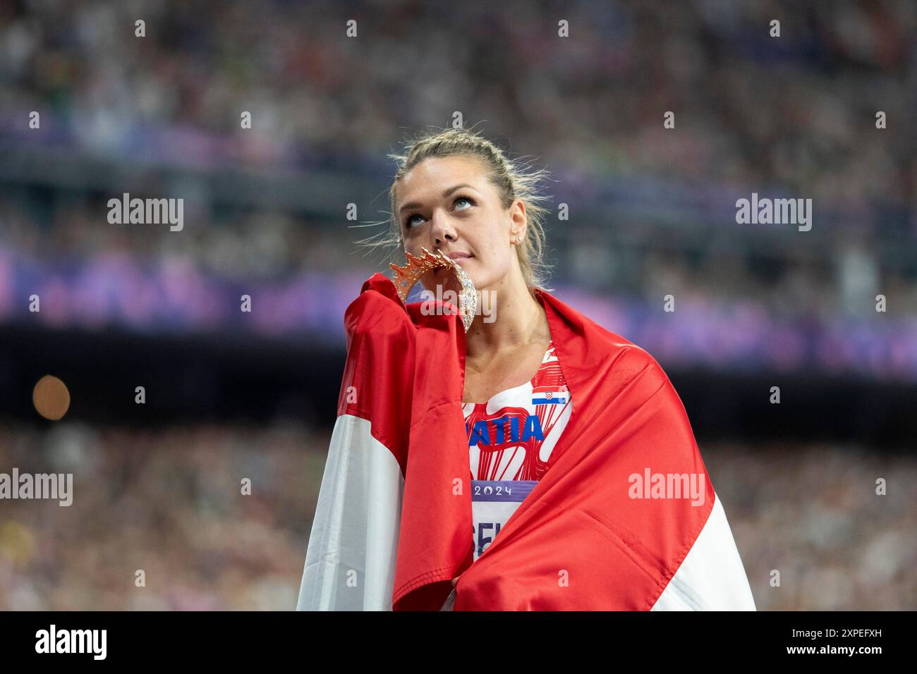 Sandra Elkasevic, of Croatia, looks up the stands as she takes a ...