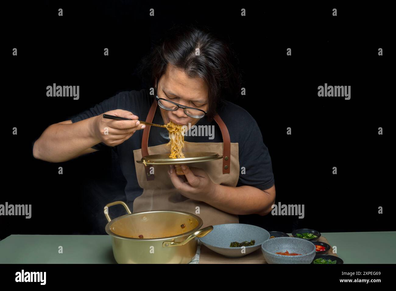Man eating instant noodles from hi-res stock photography and images - Alamy