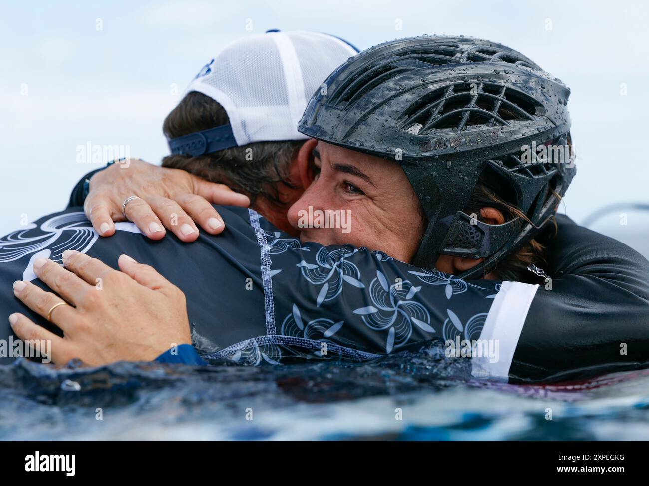 Johanne Defay, of France, right, hugs her coach and husband after ...