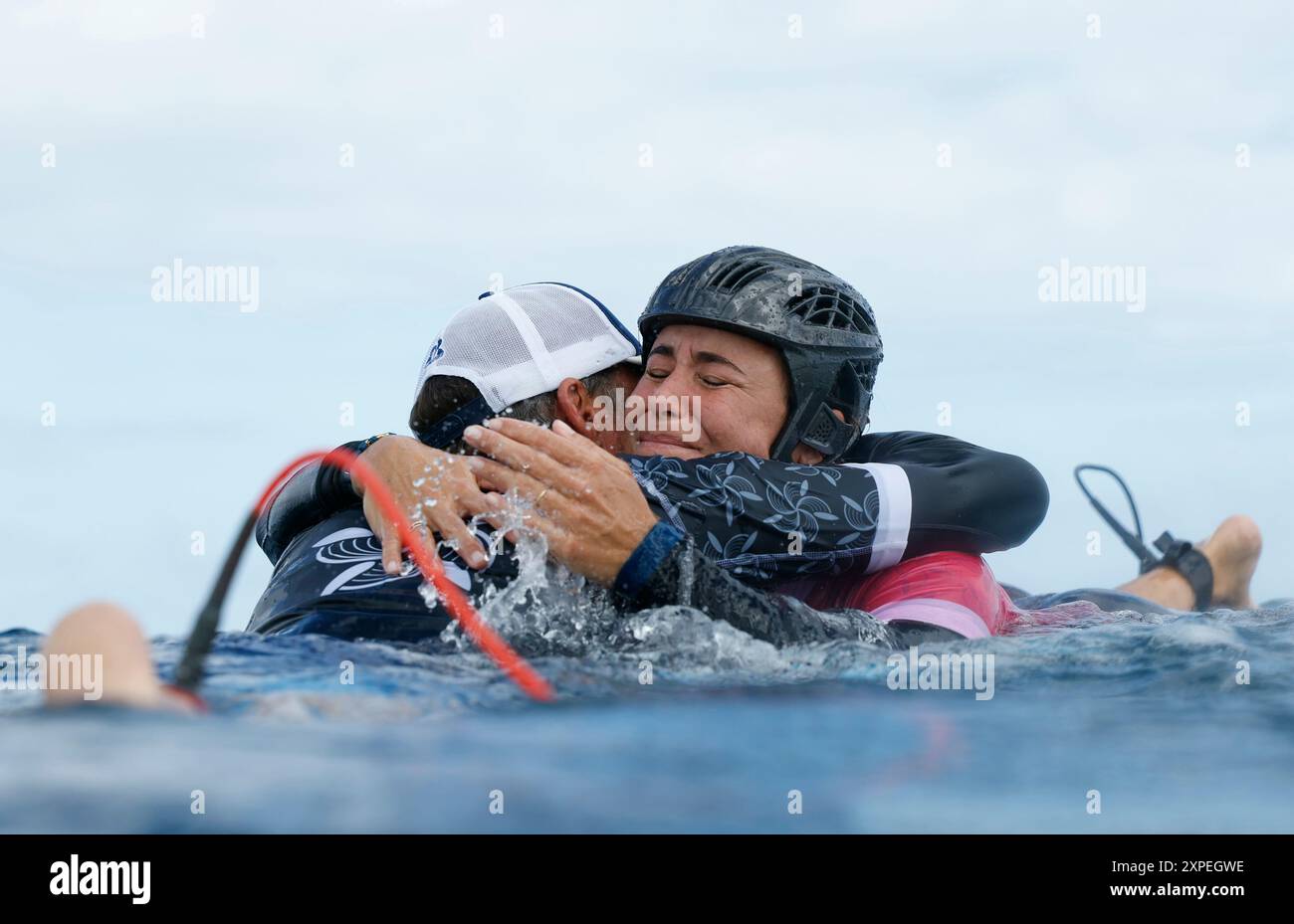 Johanne Defay, of France, right, hugs her coach and husband Simon ...
