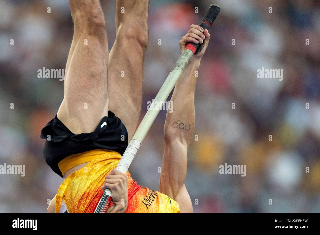 A tattoo of the Olympic rings decorates the arm of Oleg Zernikel, of ...