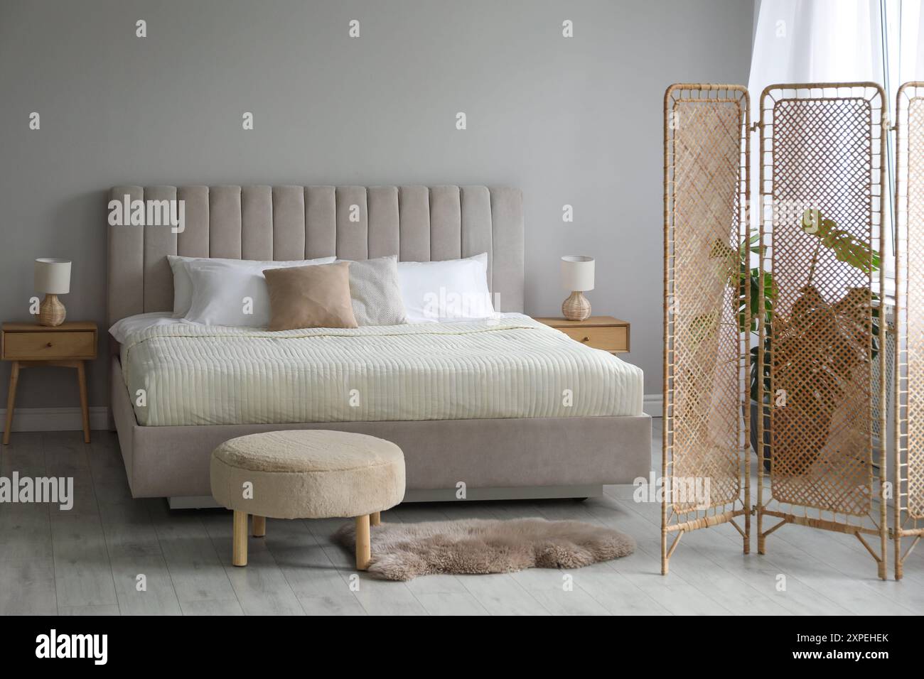 Folding screen and comfortable bed in bedroom. Interior design Stock ...