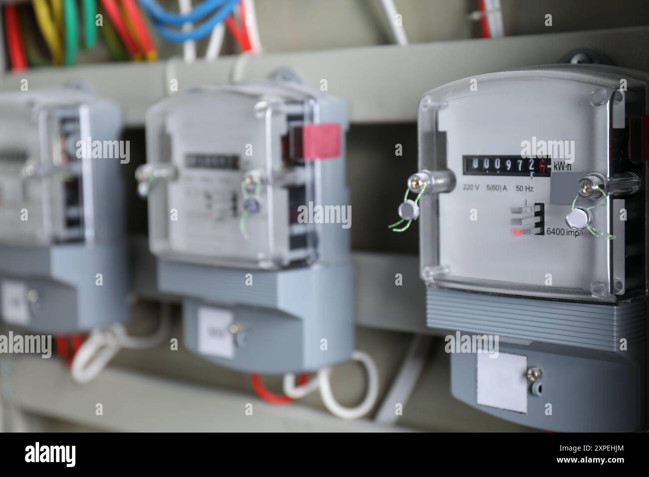 Electric meters and wires in fuse box. Energy measuring device Stock ...