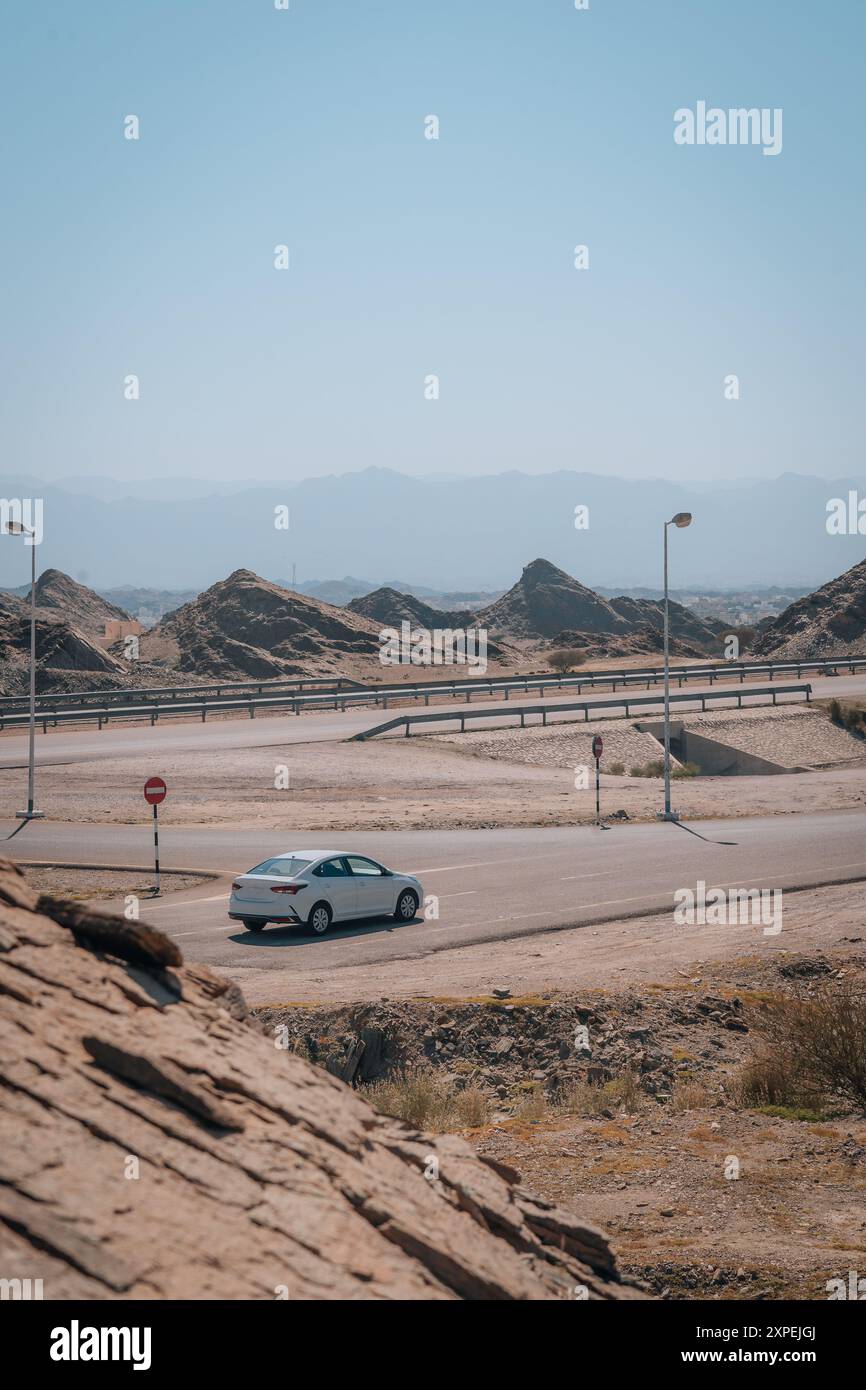 Car parked in mountain landscape Oman, on a road trip close to Muscat ...