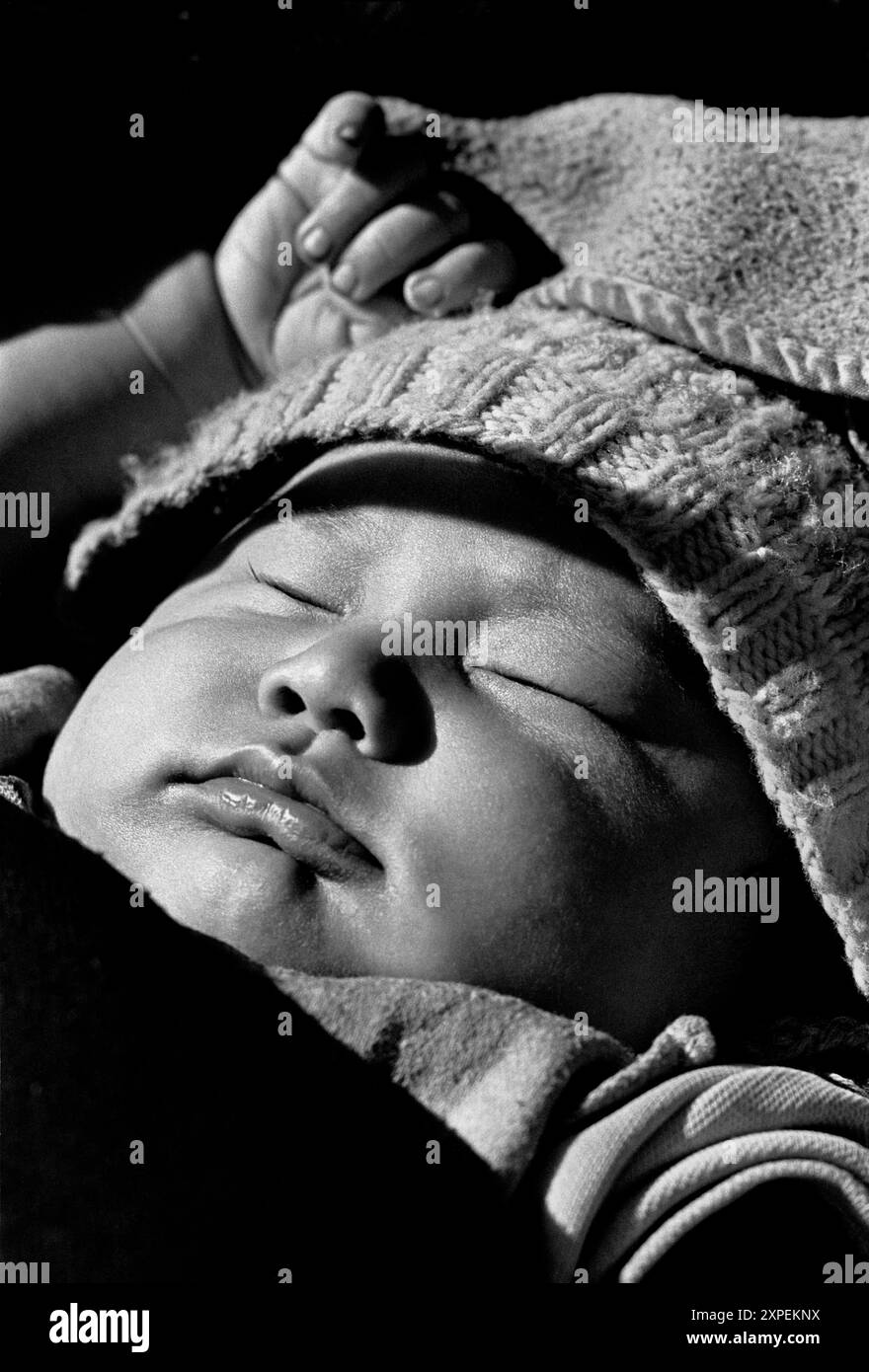 A Nepali baby sleeps peacefully in the village of Siklis - Nepal Stock ...