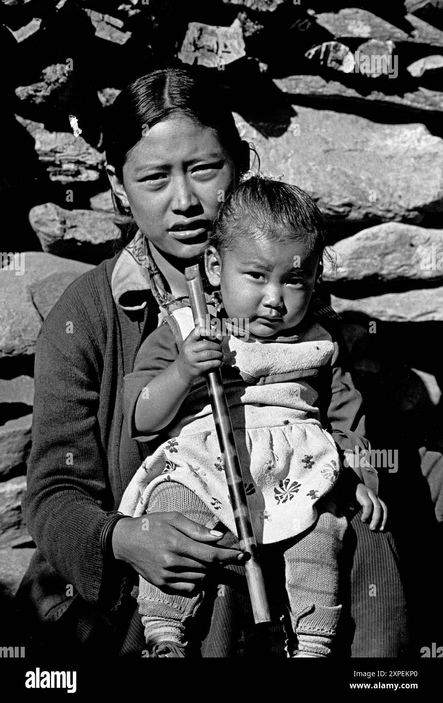 A Nepali mother and baby with a flute in the village of Siklis - Nepal ...