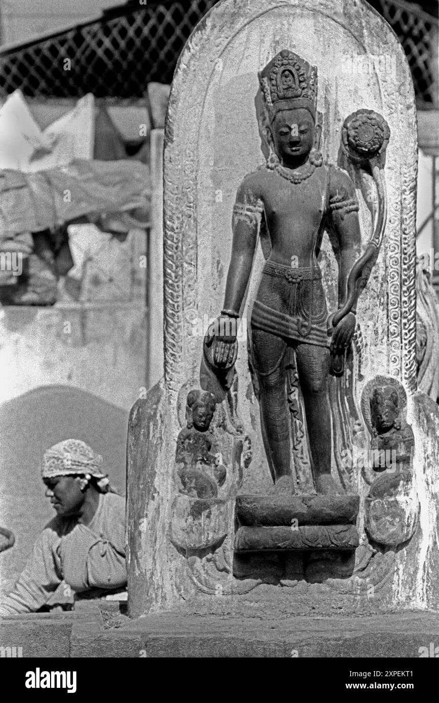 A stone statue of the Hindu god Indra at the Pashupati temple complex ...