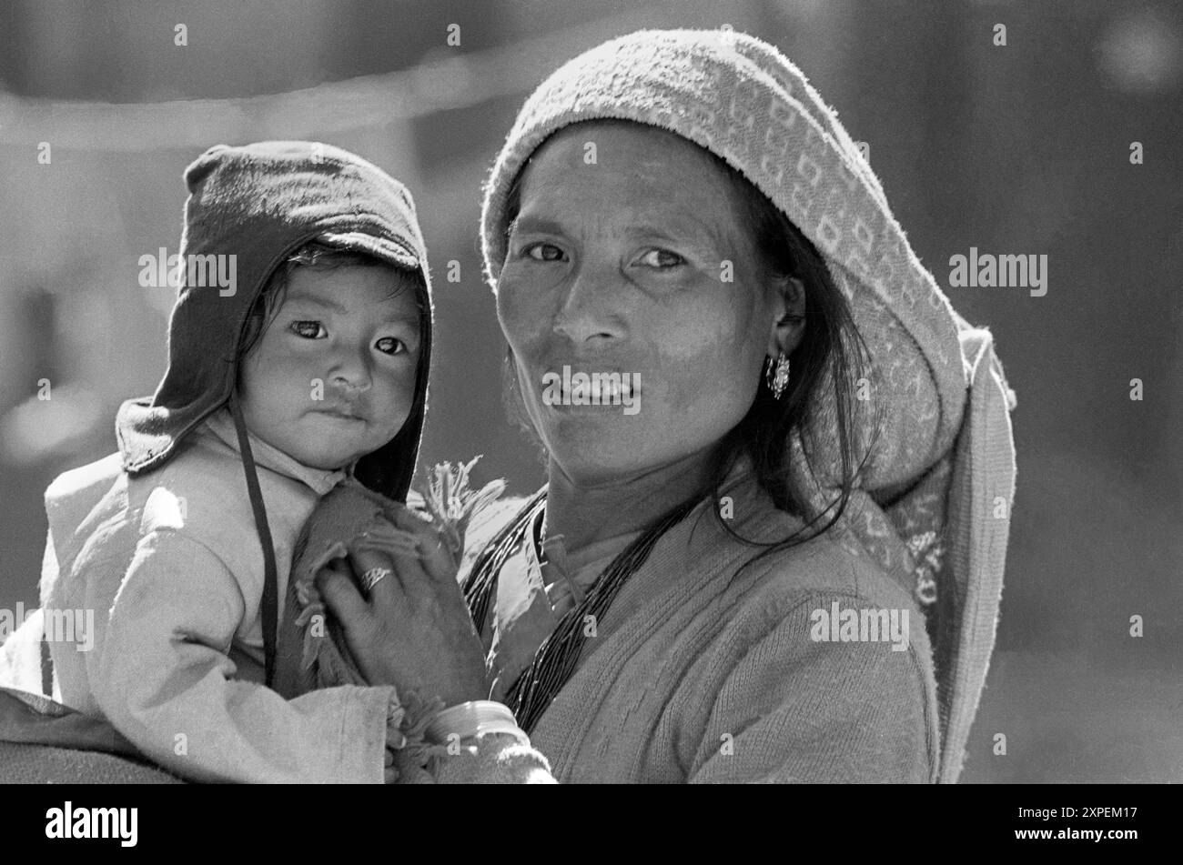 A Nepali mother holds her baby in a village in the middle hills - Nepal ...