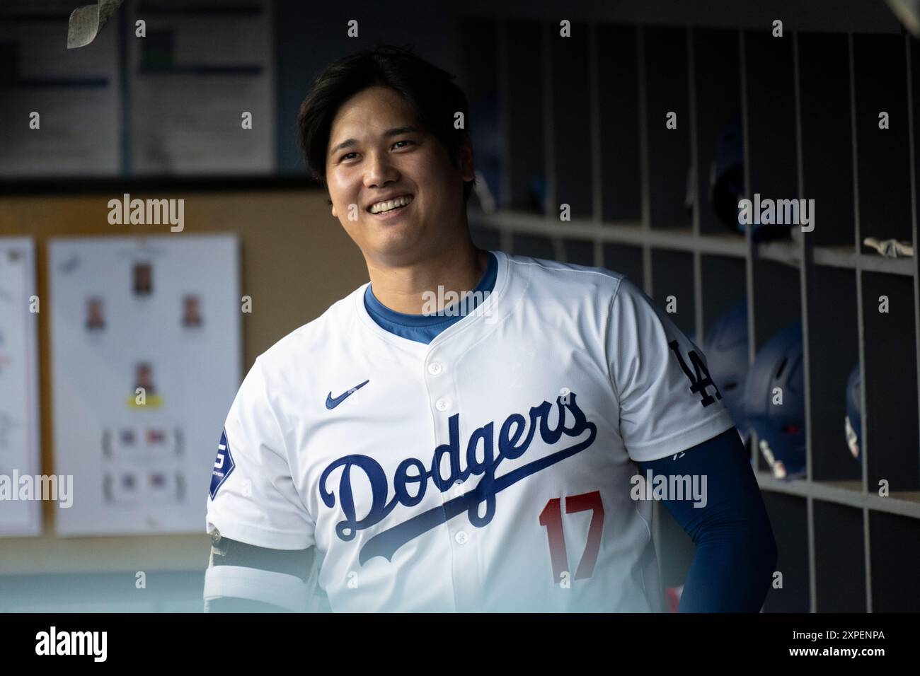 Los Angeles Dodgers' Shohei Ohtani smiles before a baseball game ...