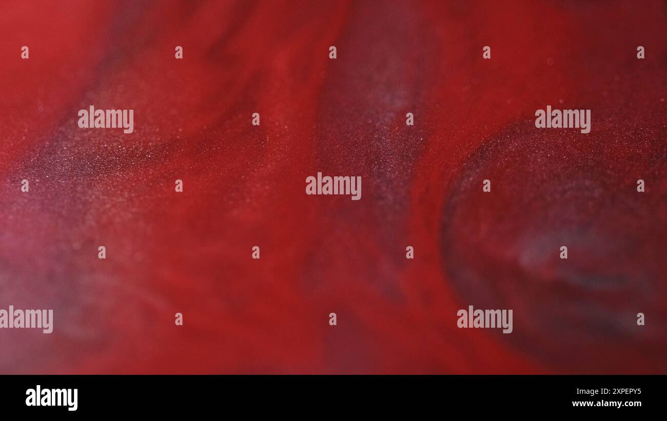 Ink liquid. Sparkling emulsion. Abstract red color mix flow glow shiny ...