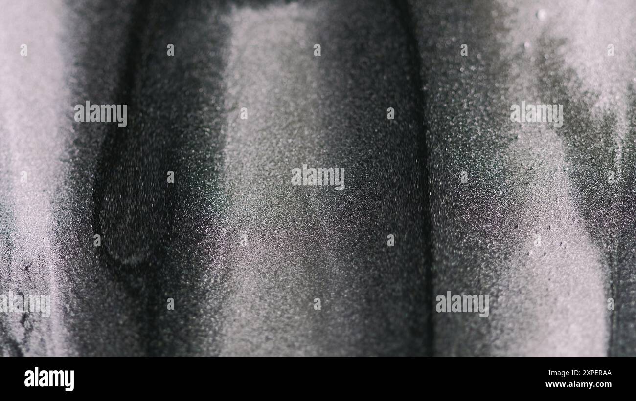 Sparkling ink. Shimmer paint. Blur black silver color flowing glowing ...