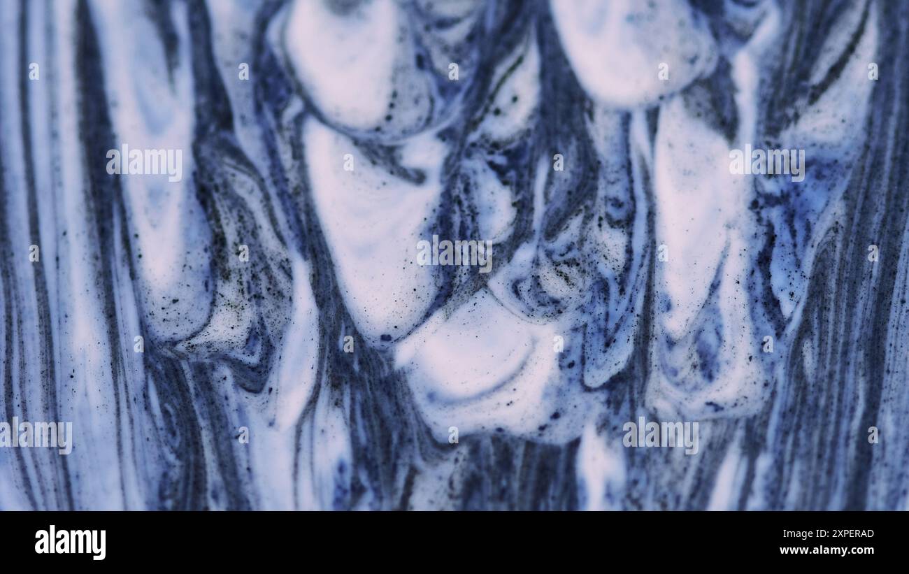 Oil liquid. Marble ink. Defocused blue white color dripping layers ...