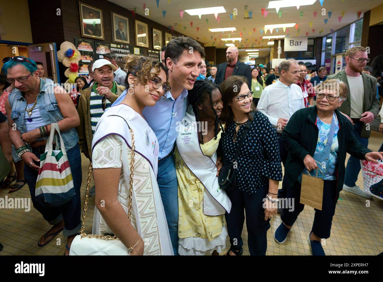 Canada Prime Minister Justin Trudeau poses with members of the audience ...