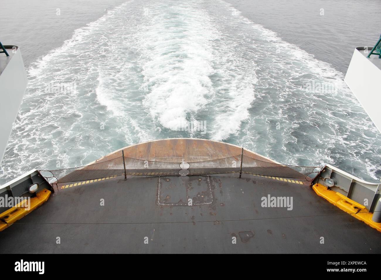A view of the back of a ferry boat and the wake evidence on the ocean ...