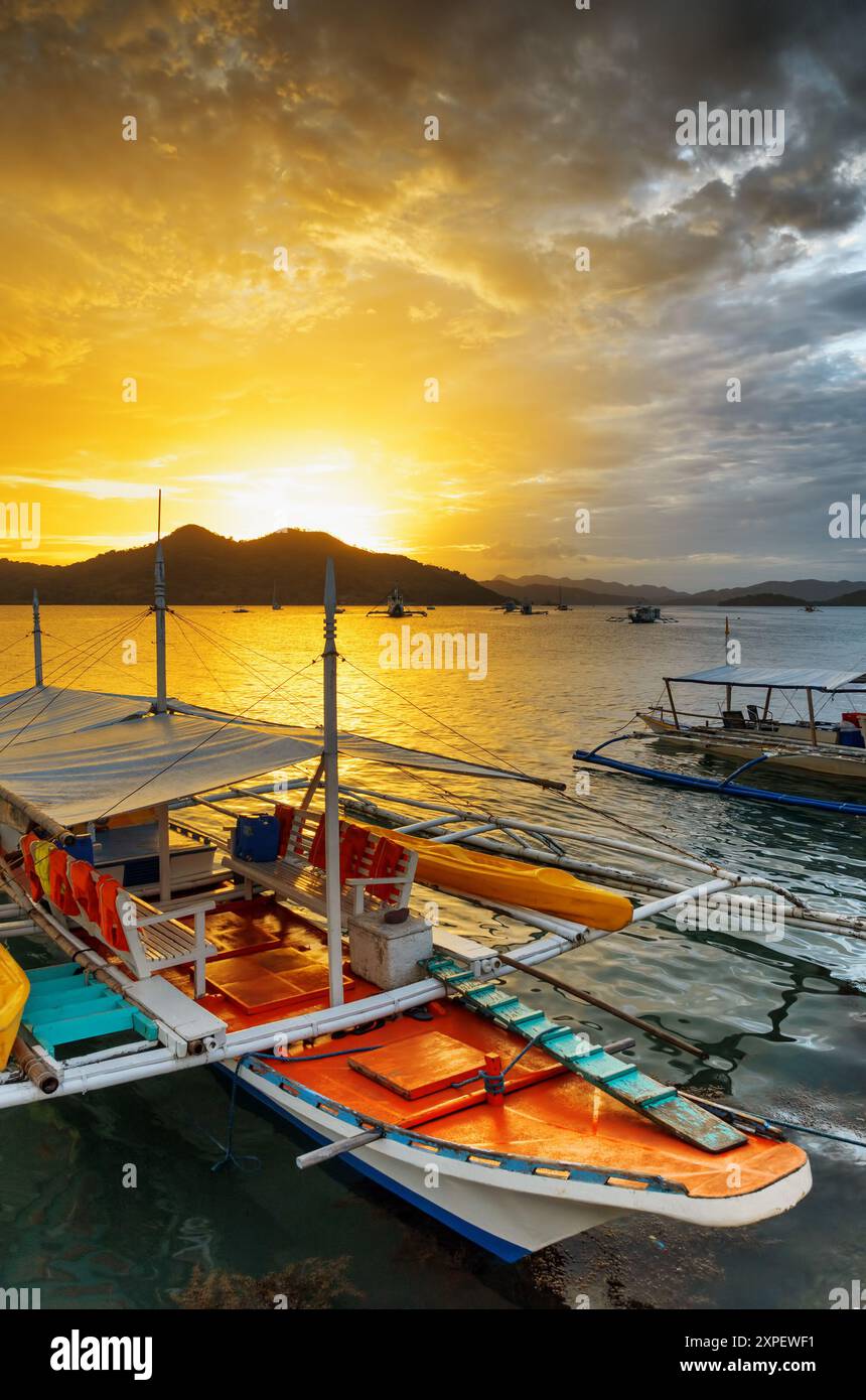 Traditional boats at sunset. Philippines Stock Photo - Alamy