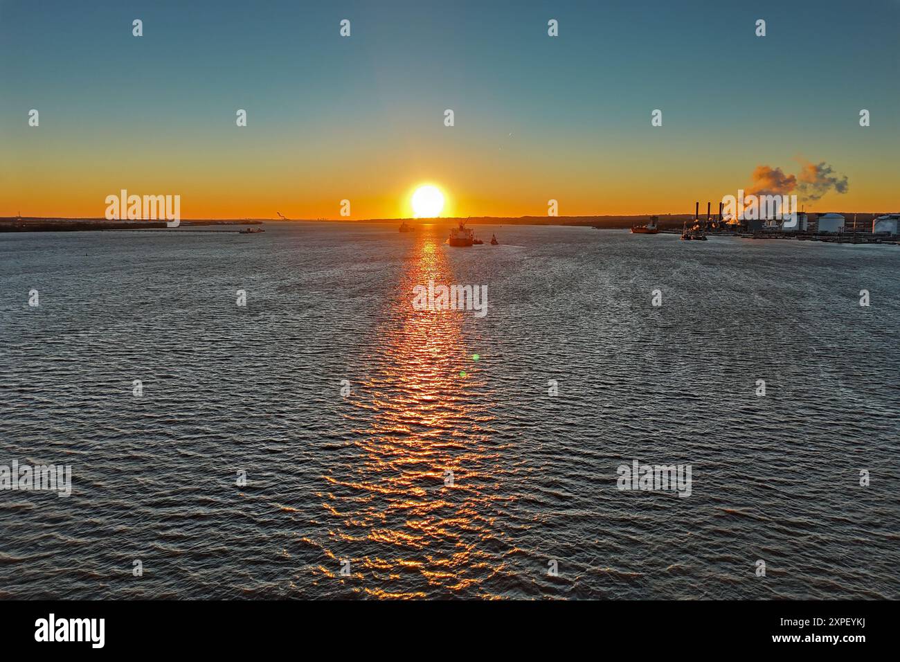 Aerial View of Sun Setting over the Water Stock Photo - Alamy