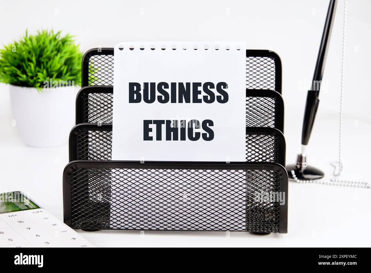 BUSINESS ETHICS written on a piece of paper on a white background Stock ...