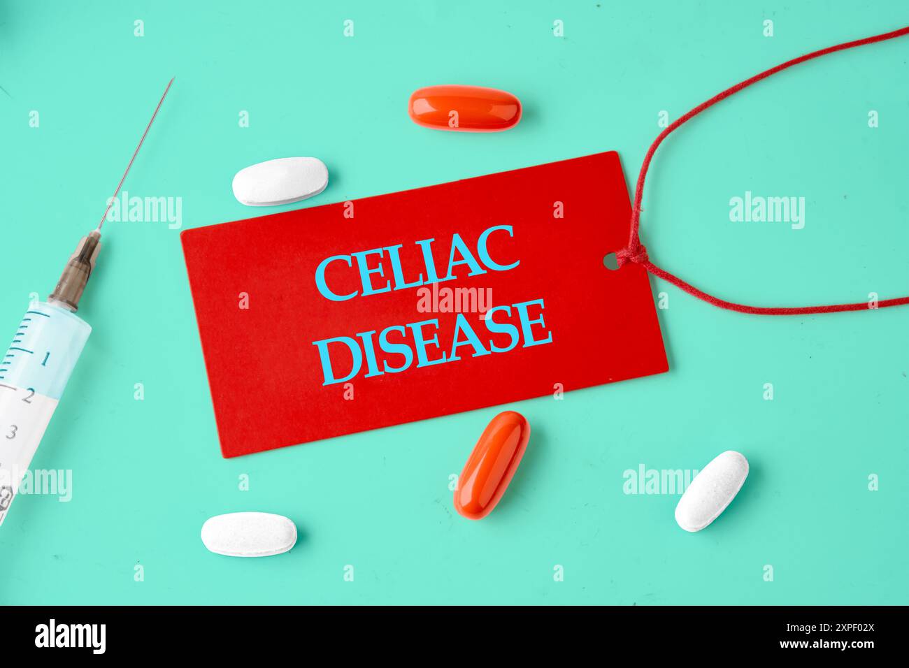Conceptual display Celiac Disease. Text CELIAC DISEASE on a red card in ...